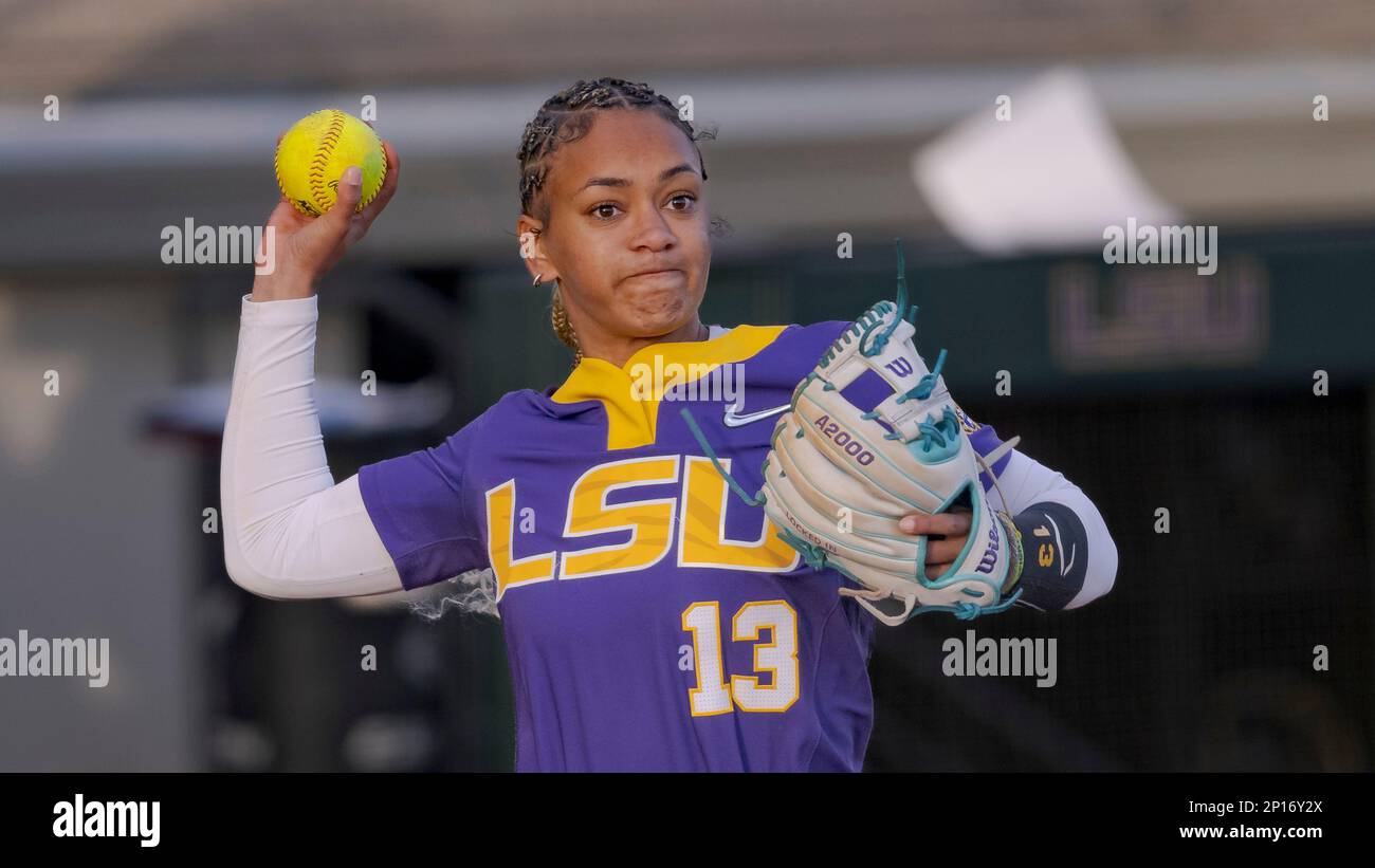 LSU infielder Danieca Coffey (13) throws during an NCAA softball game ...
