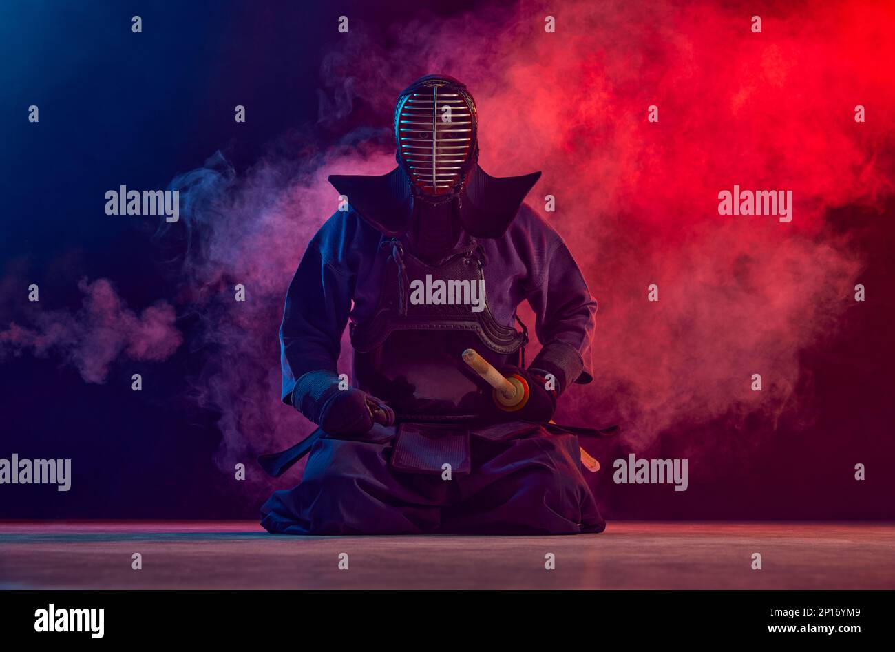 Man, professional kendo athlete, combat sportsman posing with shinai ...
