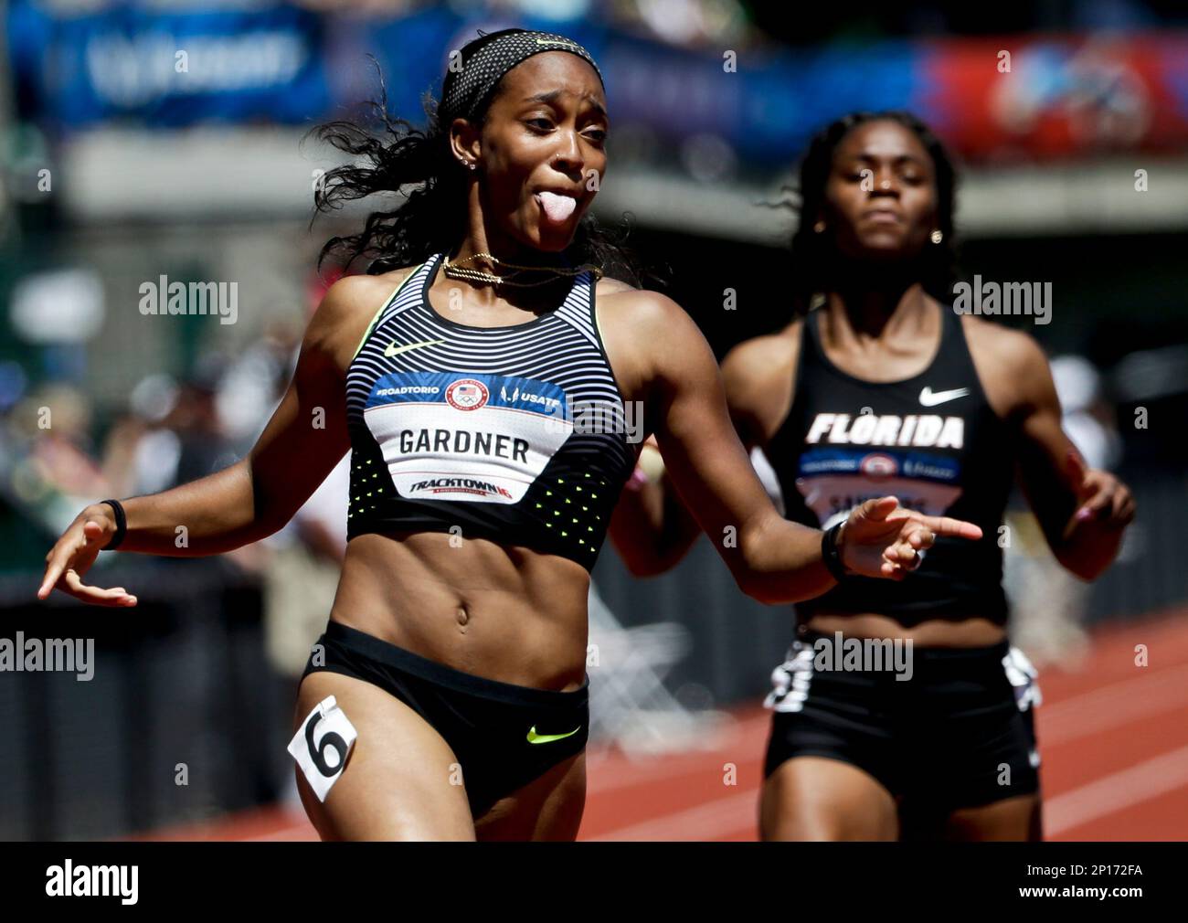 English Gardner reacts after winning her heat during qualifying for ...
