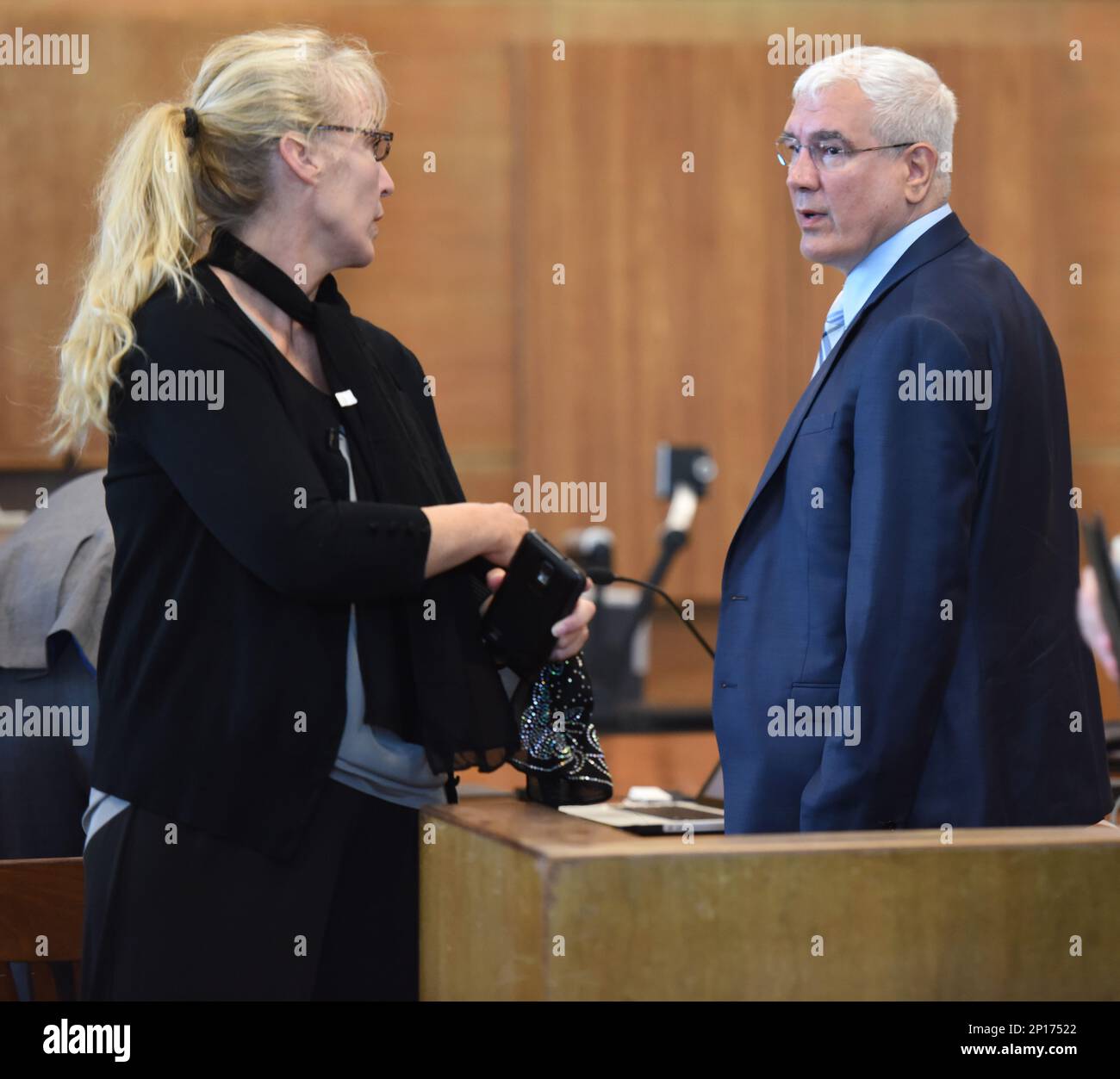 Sandra Pressey talks with her husband Kerry Max Cook before his hearing ...
