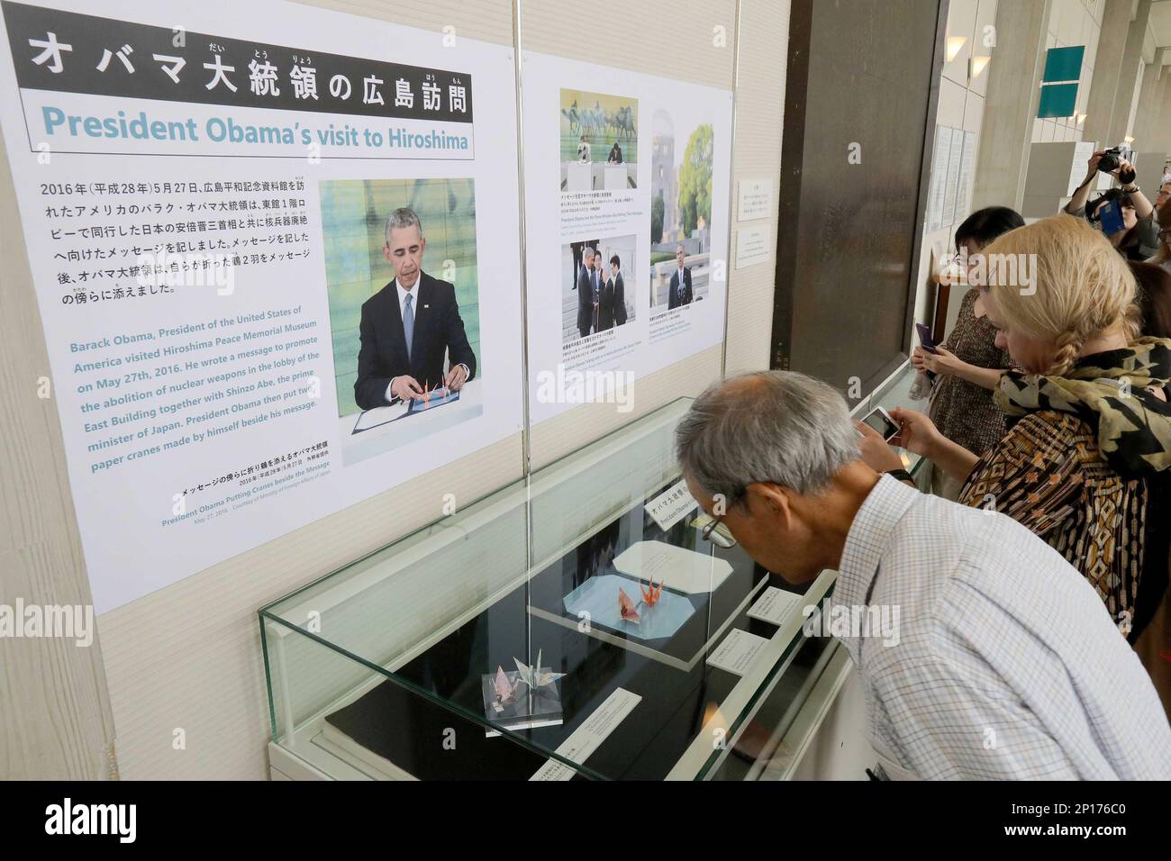Visitors to the Hiroshima Peace Memorial Museum on Thursday look at a ...
