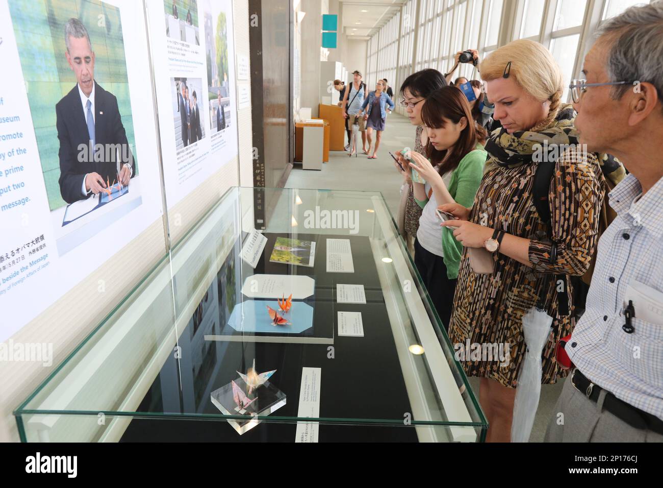Visitors to the Hiroshima Peace Memorial Museum on Thursday look at a ...