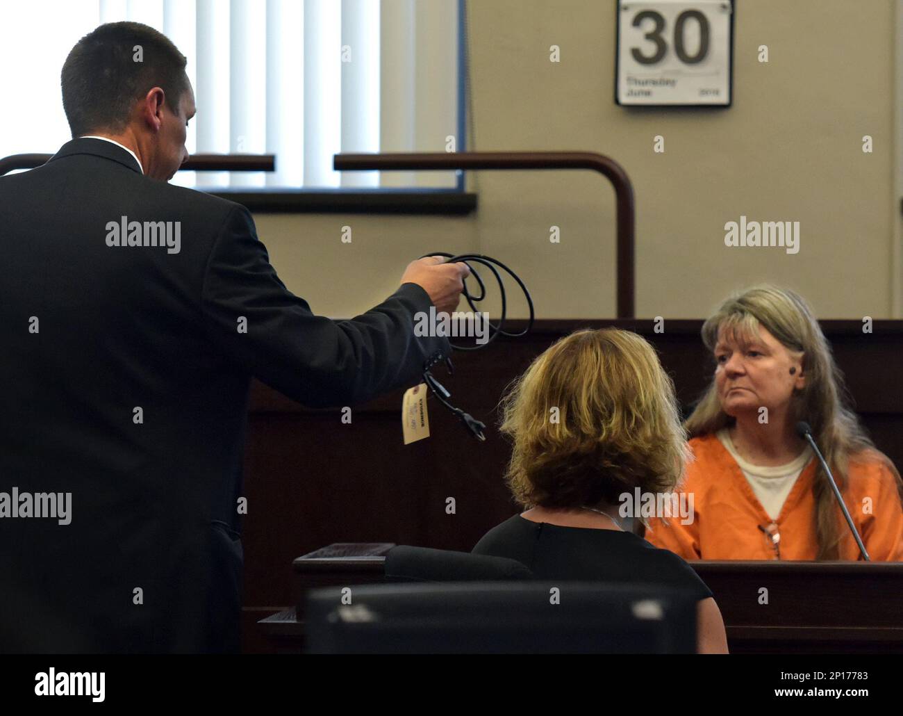 From left, Oneida County District Attorney Scott McNamara asks Deborah ...