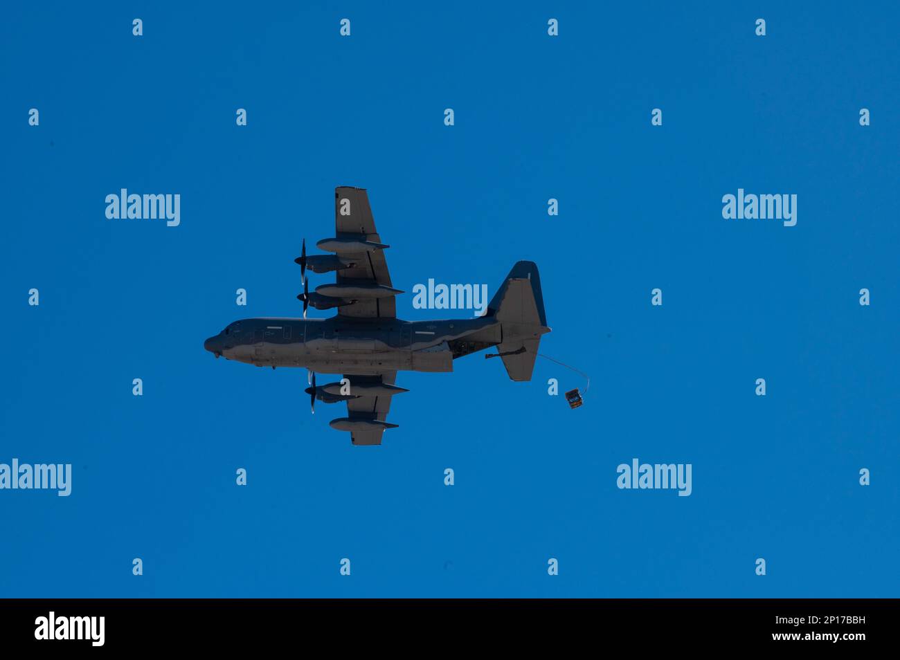 Loadmasters from the 415th Special Operations Squadron eject a cargo ...