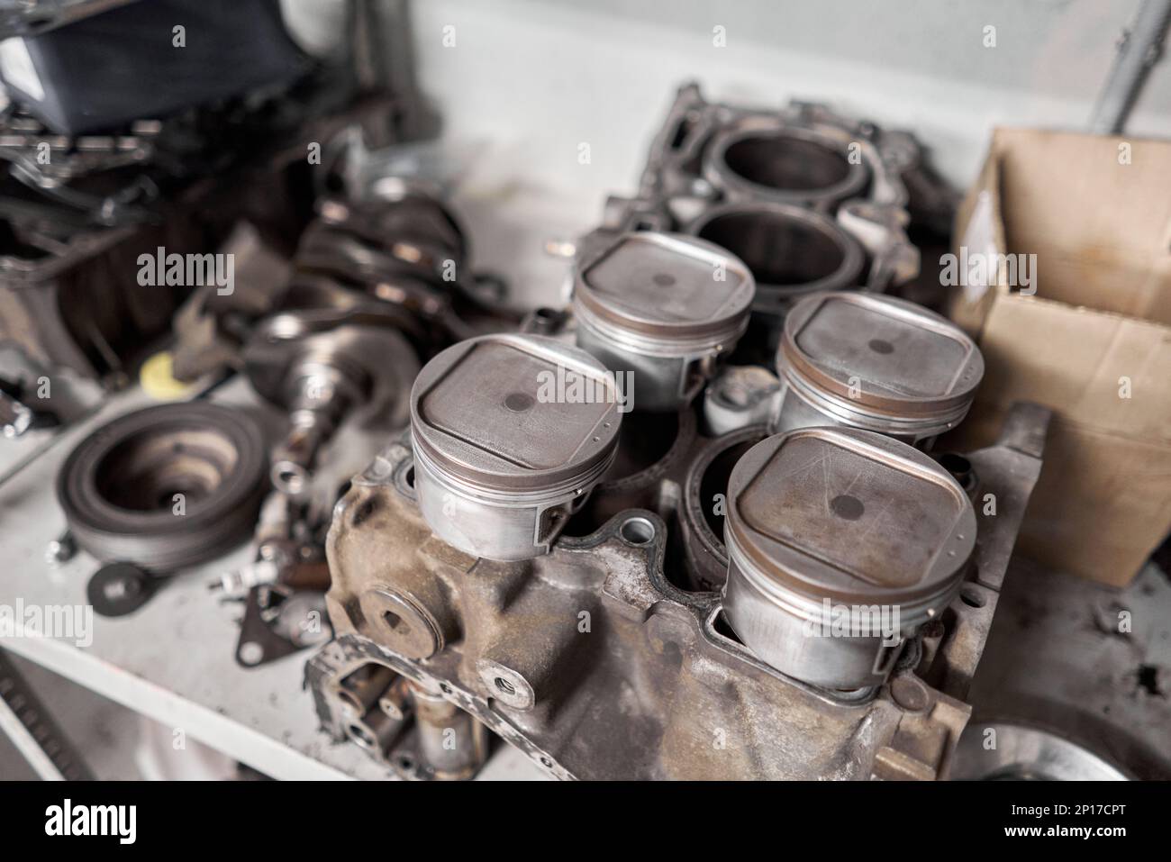 Many tools and auto spare parts car at a car repair shop. Car parts for ...