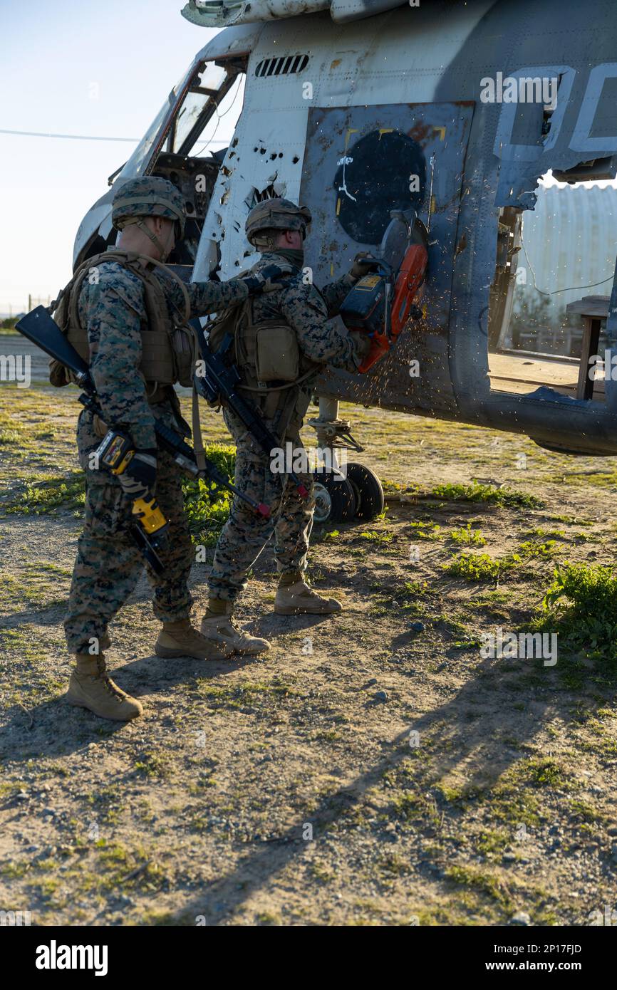 U.S. Marine Corps Sgt. Cody Zetting, right, a lead firefighter with ...