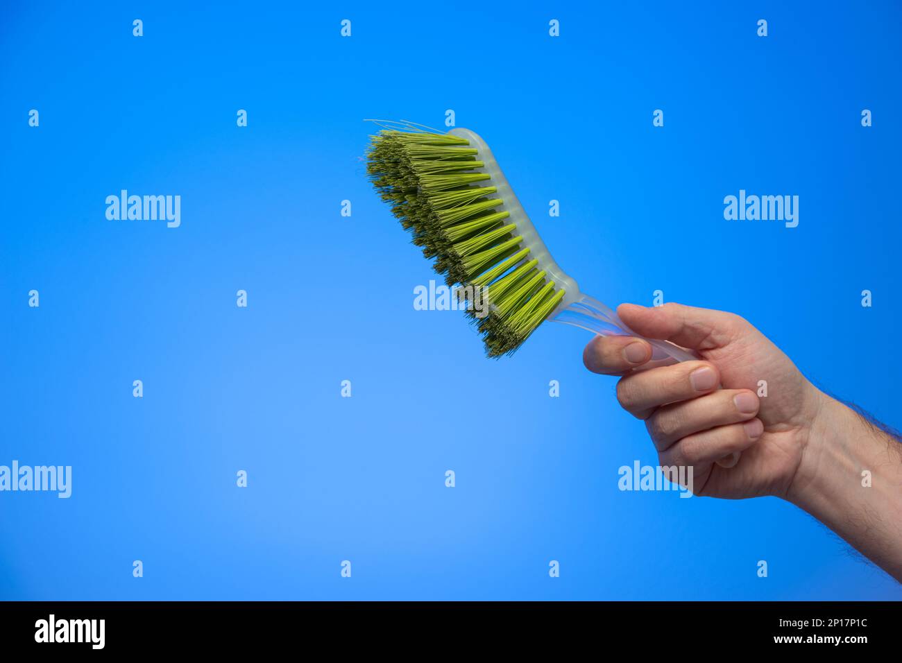 Man sweeping floor dustpan broom hi-res stock photography and images ...