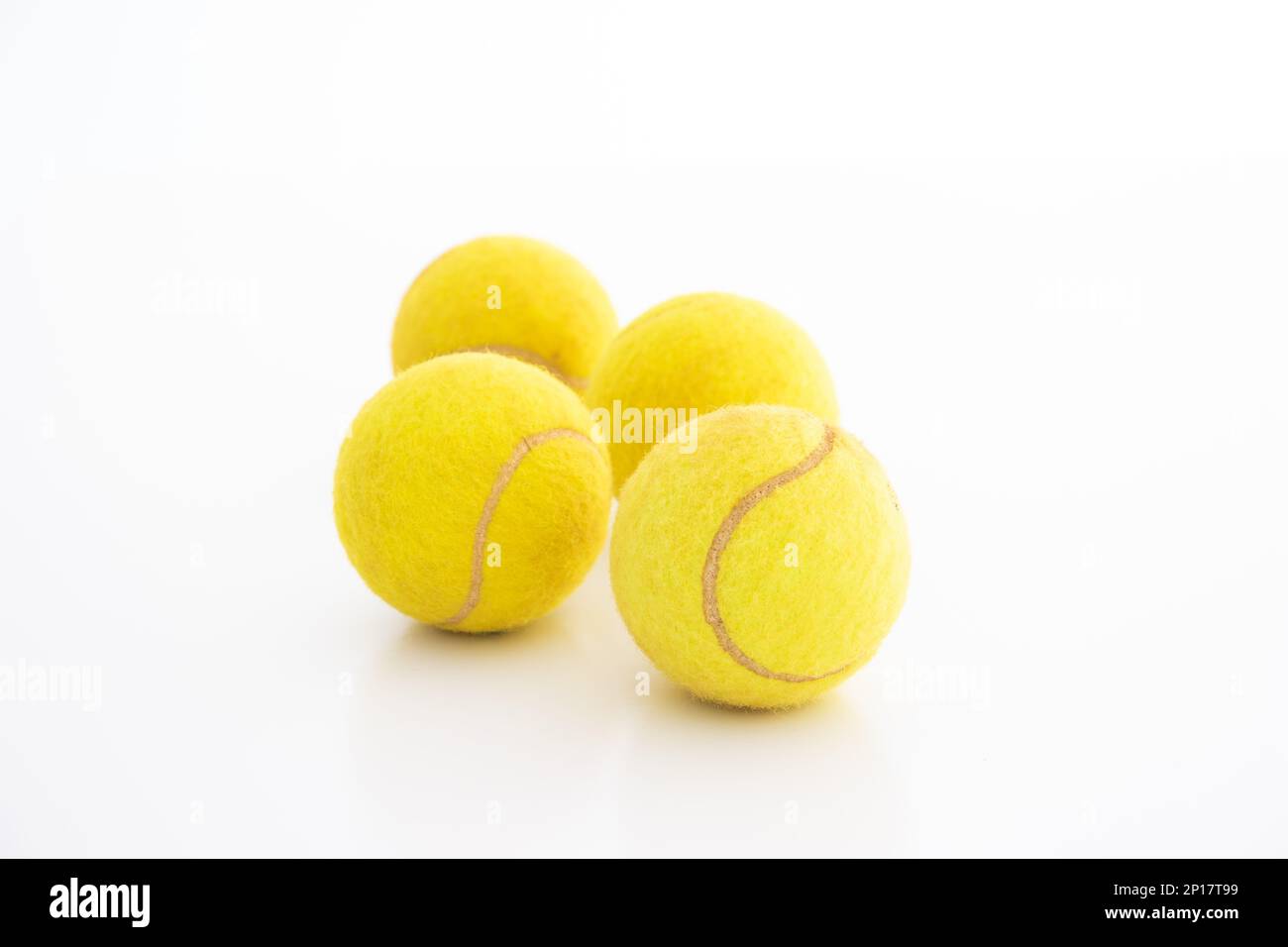 Four used generic tennis balls studio shot isolated on white background ...