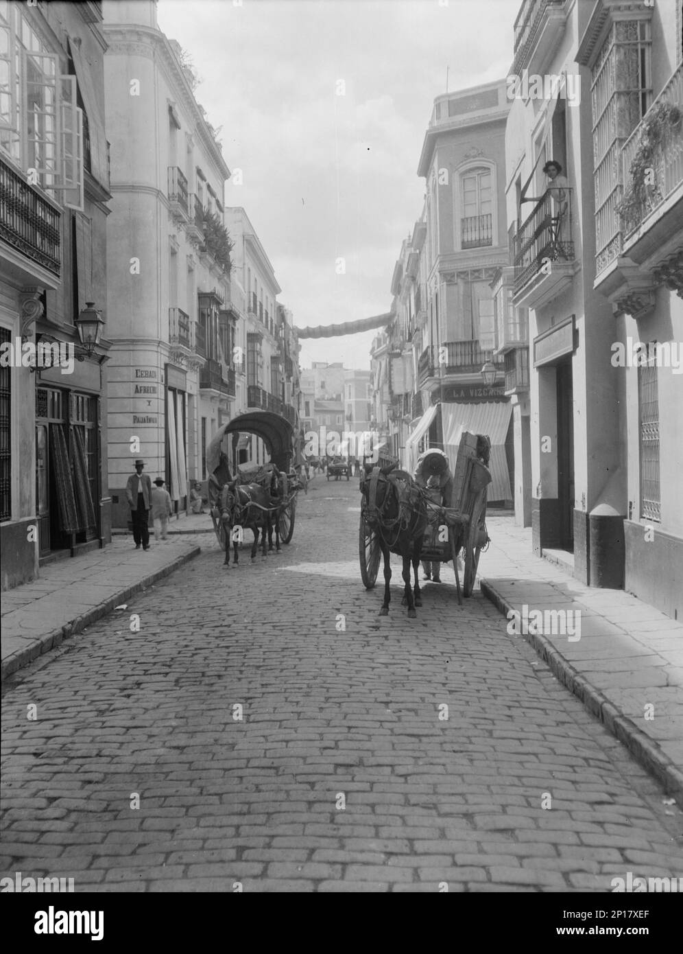 Travel views of Europe, between 1904 and 1938. Mule carts on cobbled ...