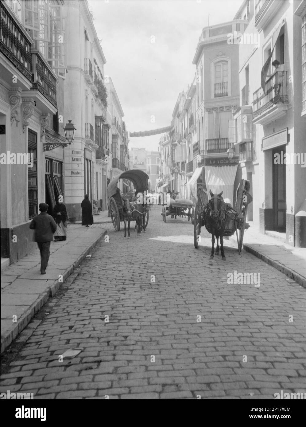 Travel views of Europe, between 1904 and 1938. Mule carts on cobbled ...