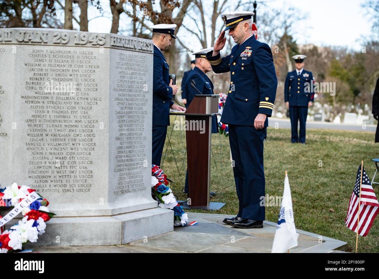 U.S. Coast Guard Lt. Cdr. Johnston Ariail renders honors after placing ...