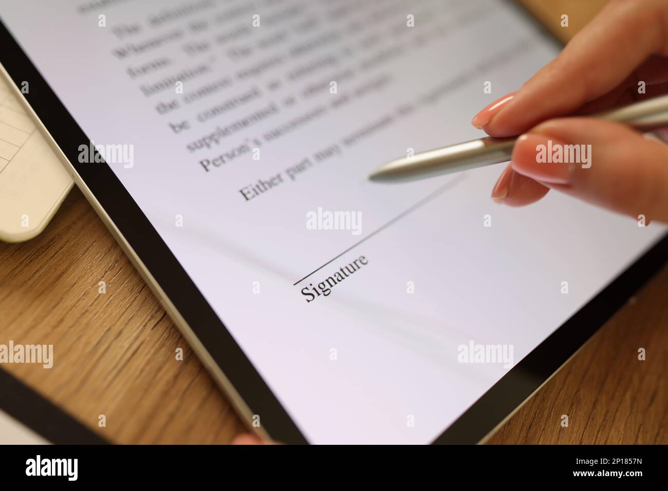 Female hand signing e-document with stylus on tablet Stock Photo - Alamy