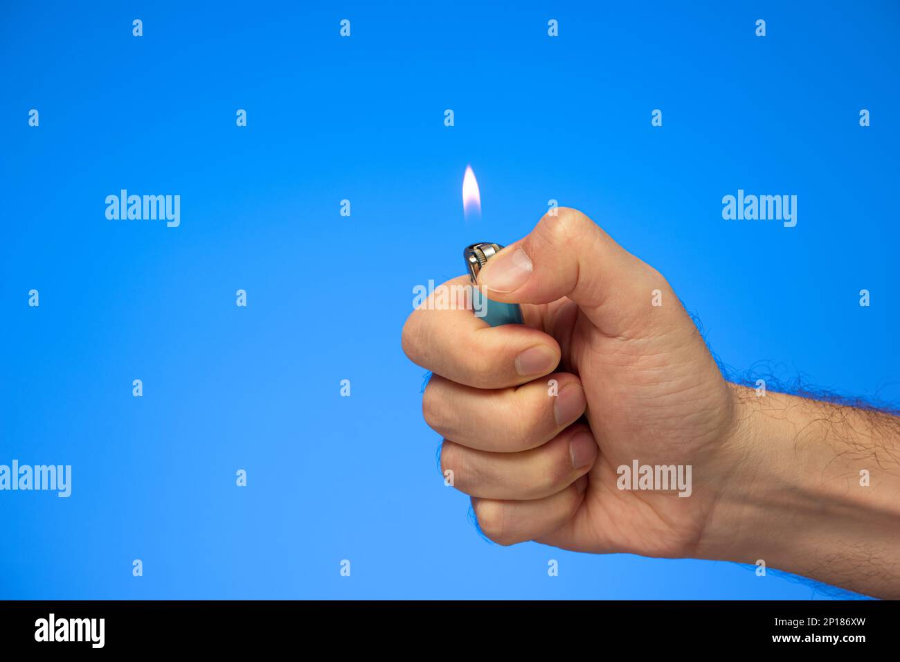 Hand holding lighter hi-res stock photography and images - Alamy