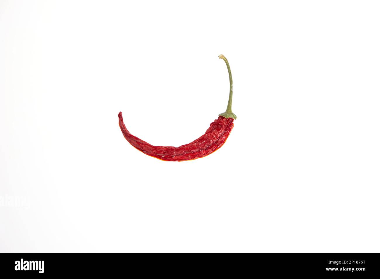 Sun dried whole red hot chili pepper floating studio shot isolated on ...