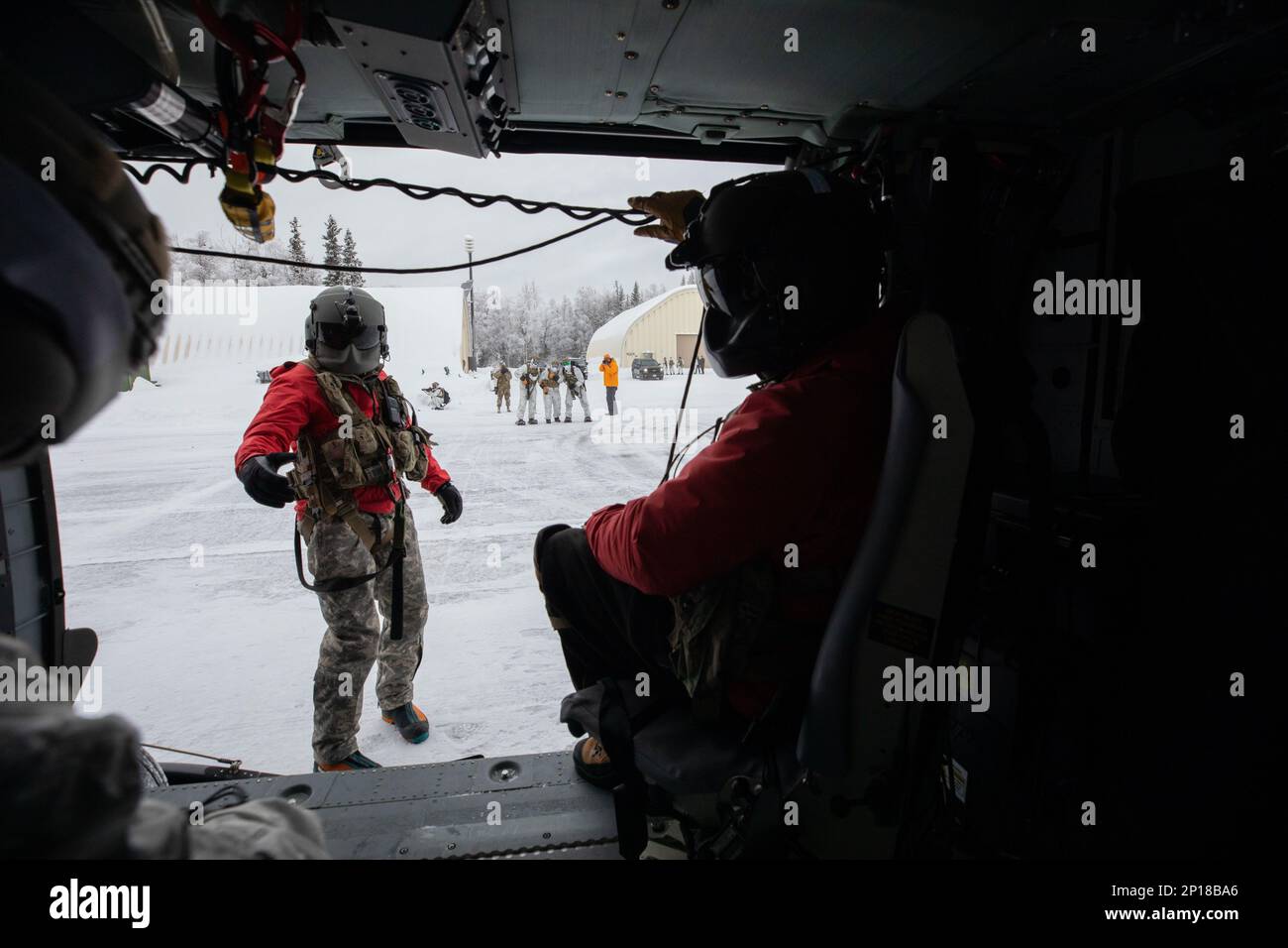 Alaska Army Guard Spc. Matthew Tucker, left, a flight medic, and Staff ...