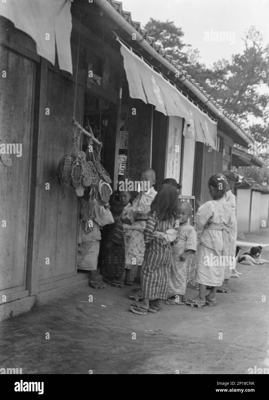 Travel views of Japan and Korea, 1908. Children outside a shop, woven ...