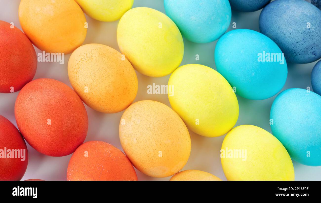 Easter background of colored eggs laid out diagonally in a gradient ...
