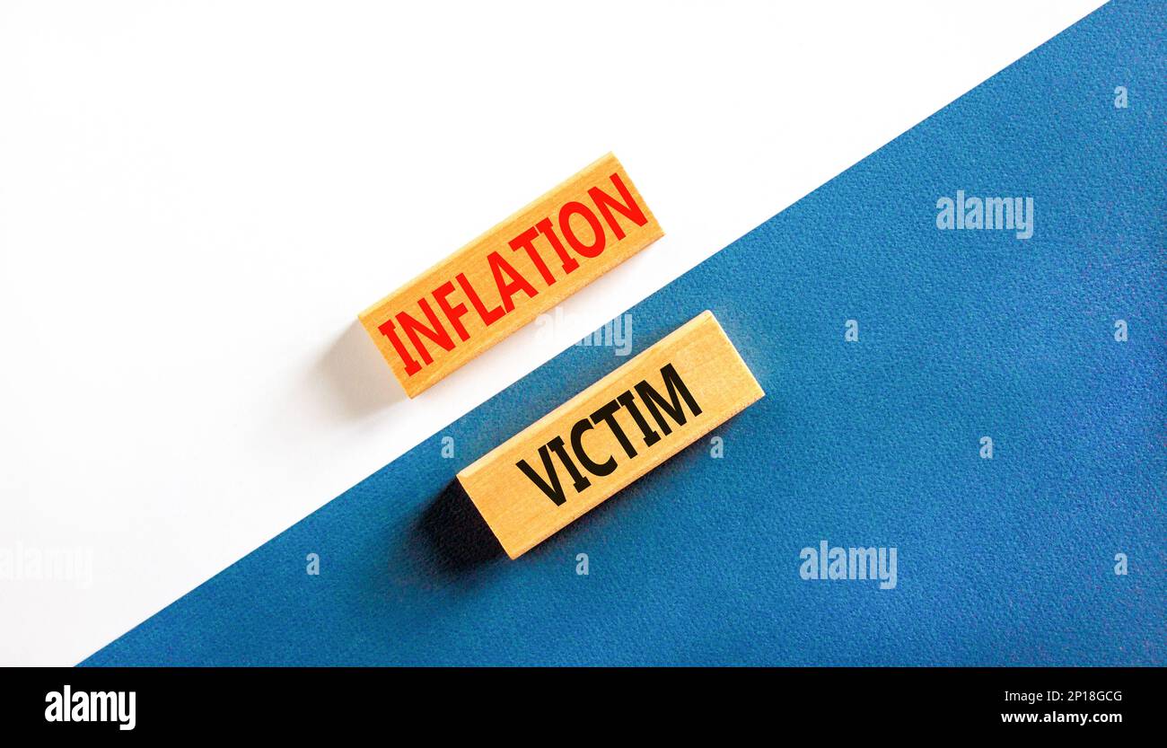 Inflation victim symbol. Concept words Inflation victim on wooden block ...
