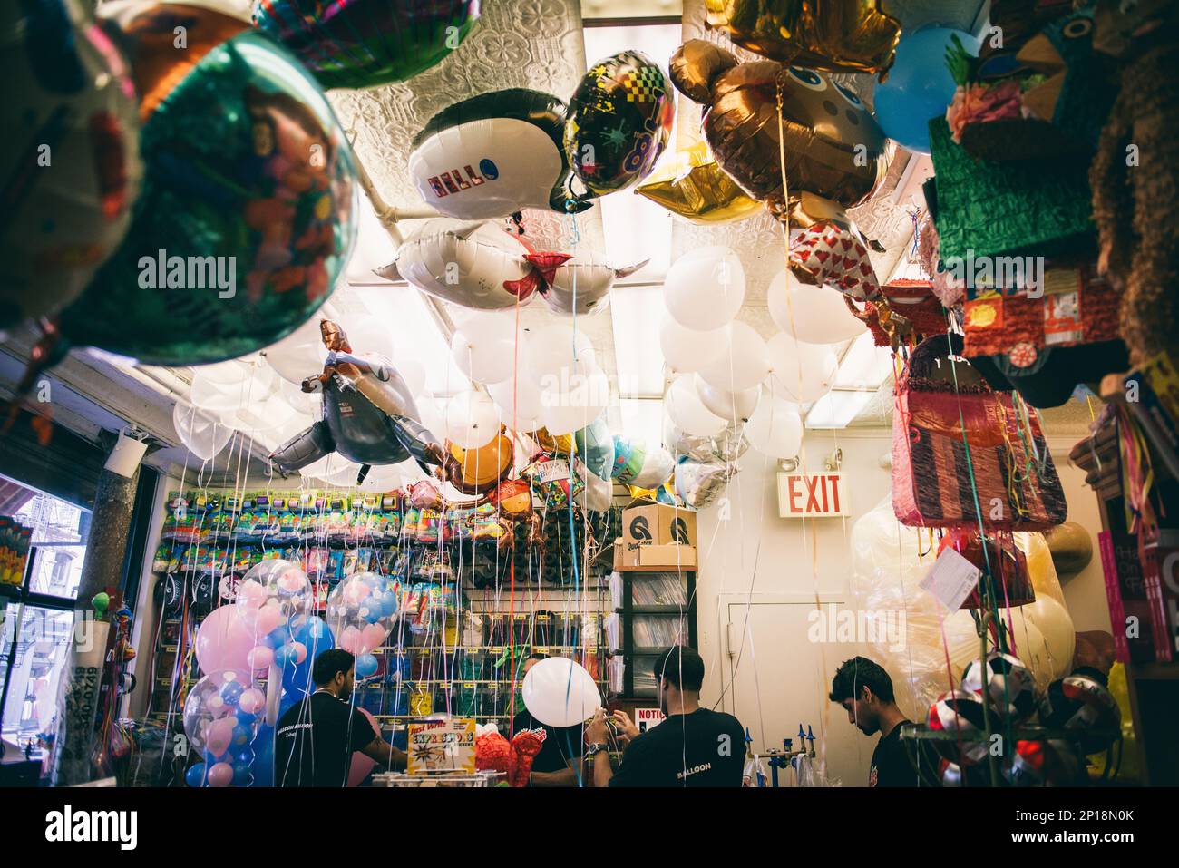 Party shop with many balloons in the ceiling Stock Photo - Alamy