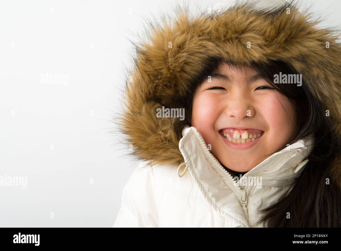 Young asian girl in winter coat Stock Photo - Alamy