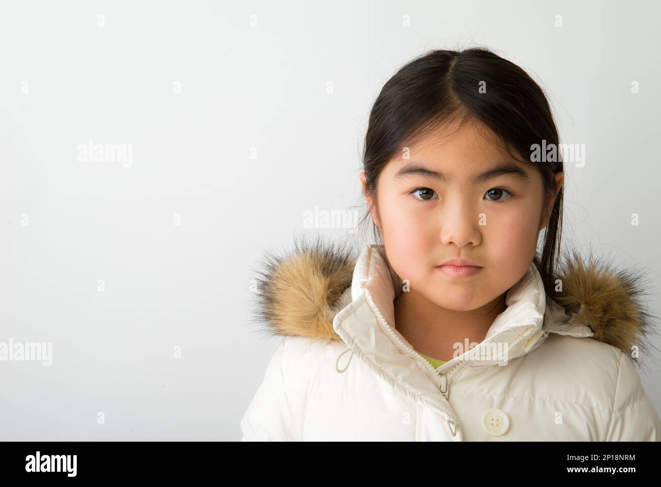 Young asian girl in winter coat Stock Photo - Alamy