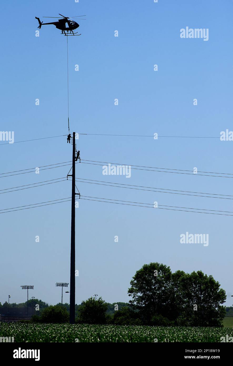 In this photo taken Wednesday, June 15, 2016, a helicopter delivers a ...