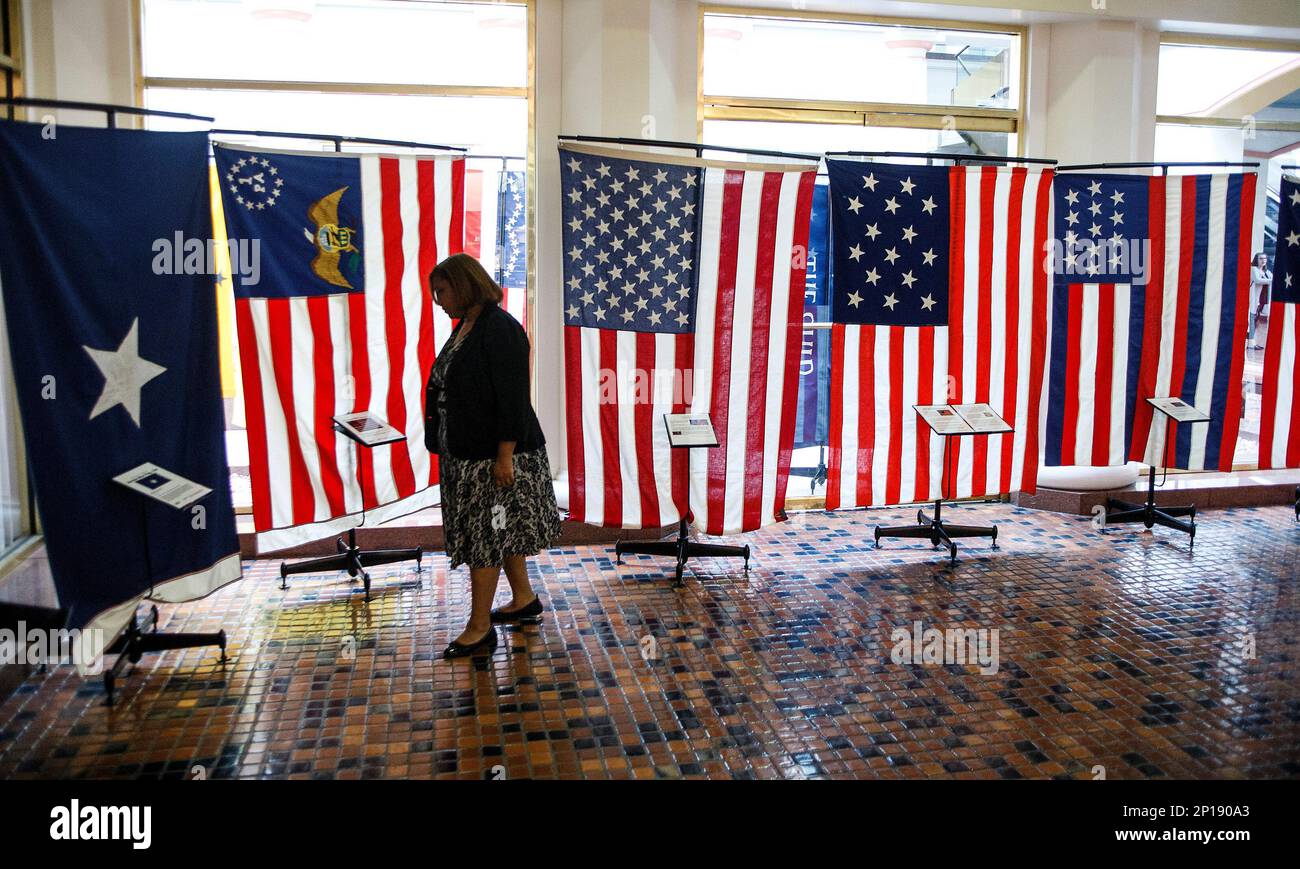 State Rep. Vanessa Lowery Brown, D-Philadelphia, looks at flags after ...