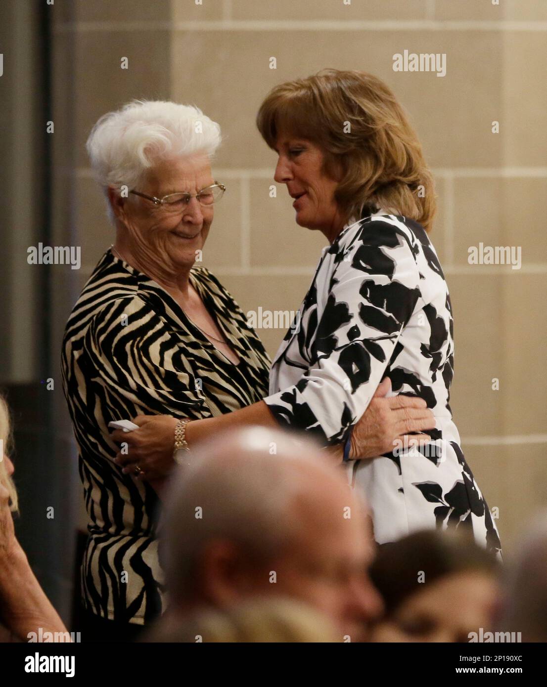 Cathy Howe, right, embraces her aunt Helen Cummine at the Cathedral of ...