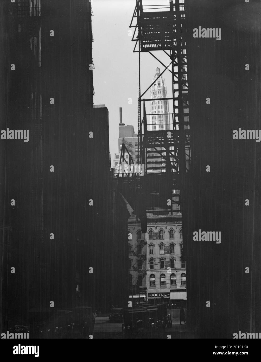 View between buildings of Mather Building/Tower in distance. Chicago ...