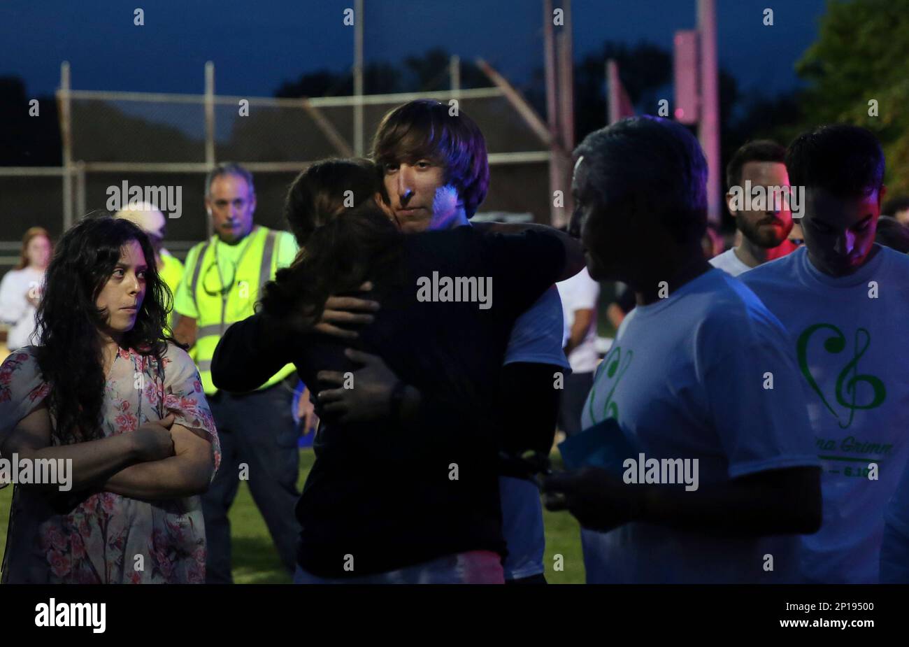 Marcus Grimmie, center, is hugged during a vigil for his sister ...