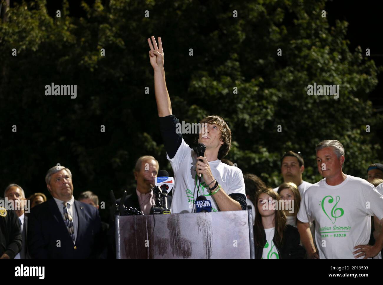 Marcus Grimmie, reaches toward the sky as he talks about his sister ...