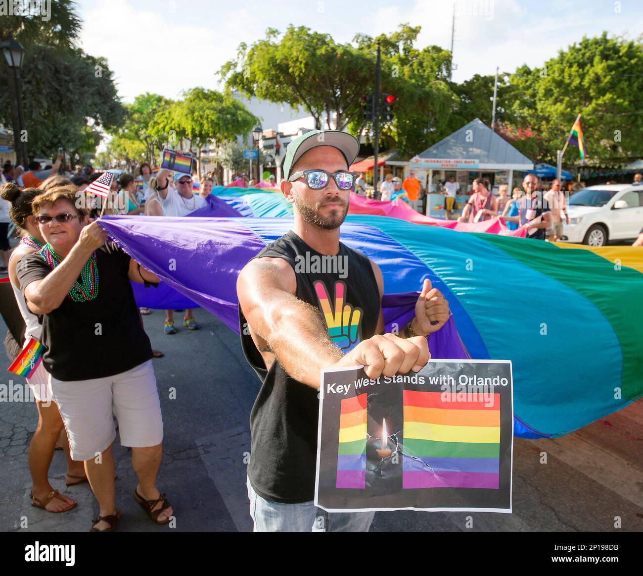 Key West resident Danny Gilbert displays one of many signs showing the ...
