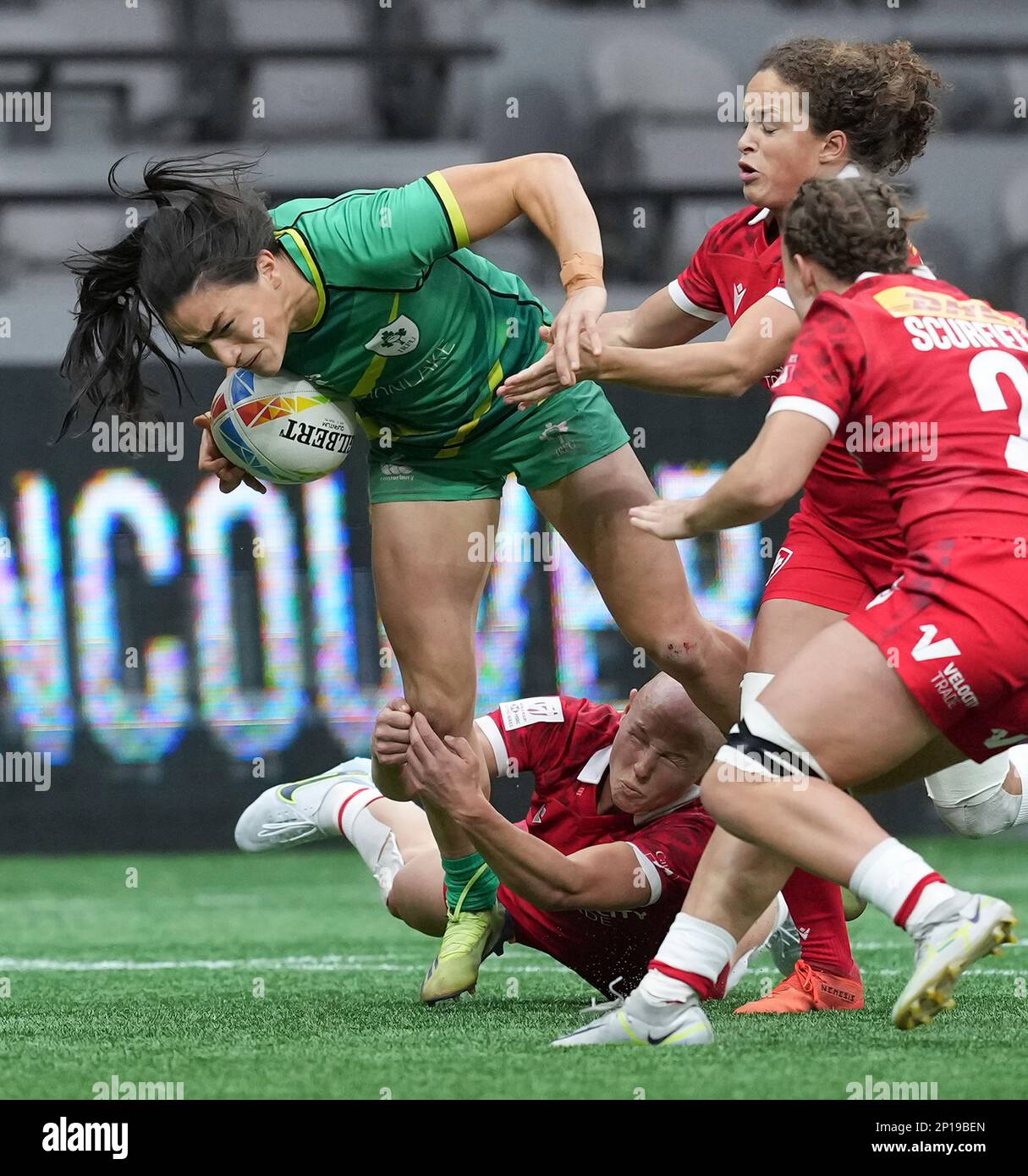 Canada's Olivia Apps, bottom, and teammates tackle Ireland's Lucy ...