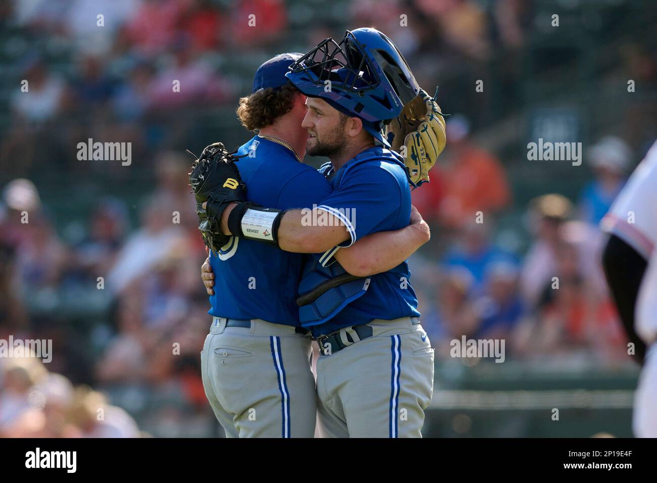 Toronto Blue Jays pitcher Hayden Juenger (76) hugs catcher Phil Clarke ...