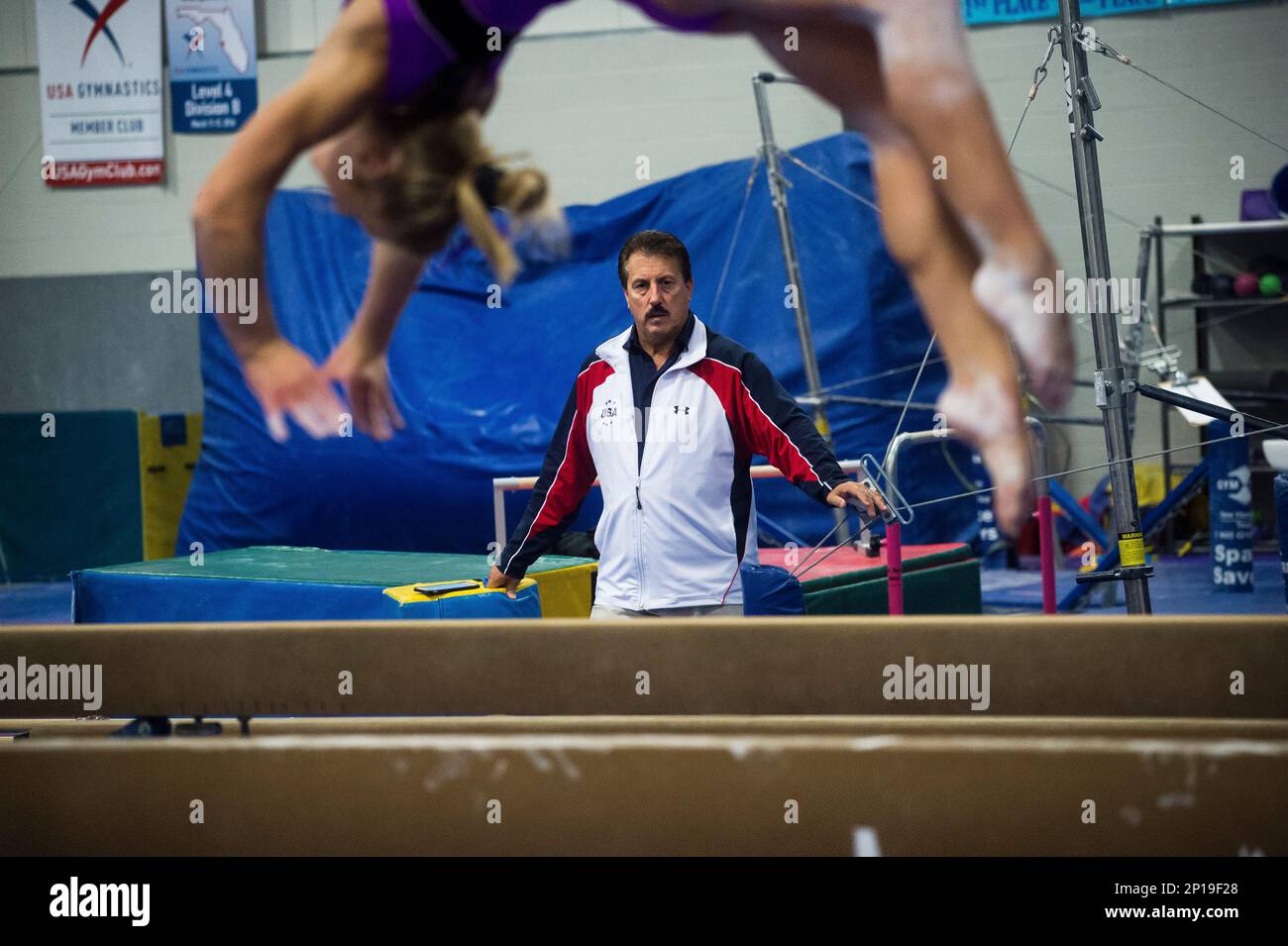 Steve Nunno, a renowned 1996 USA women's gymnastics coach, helps Emily ...