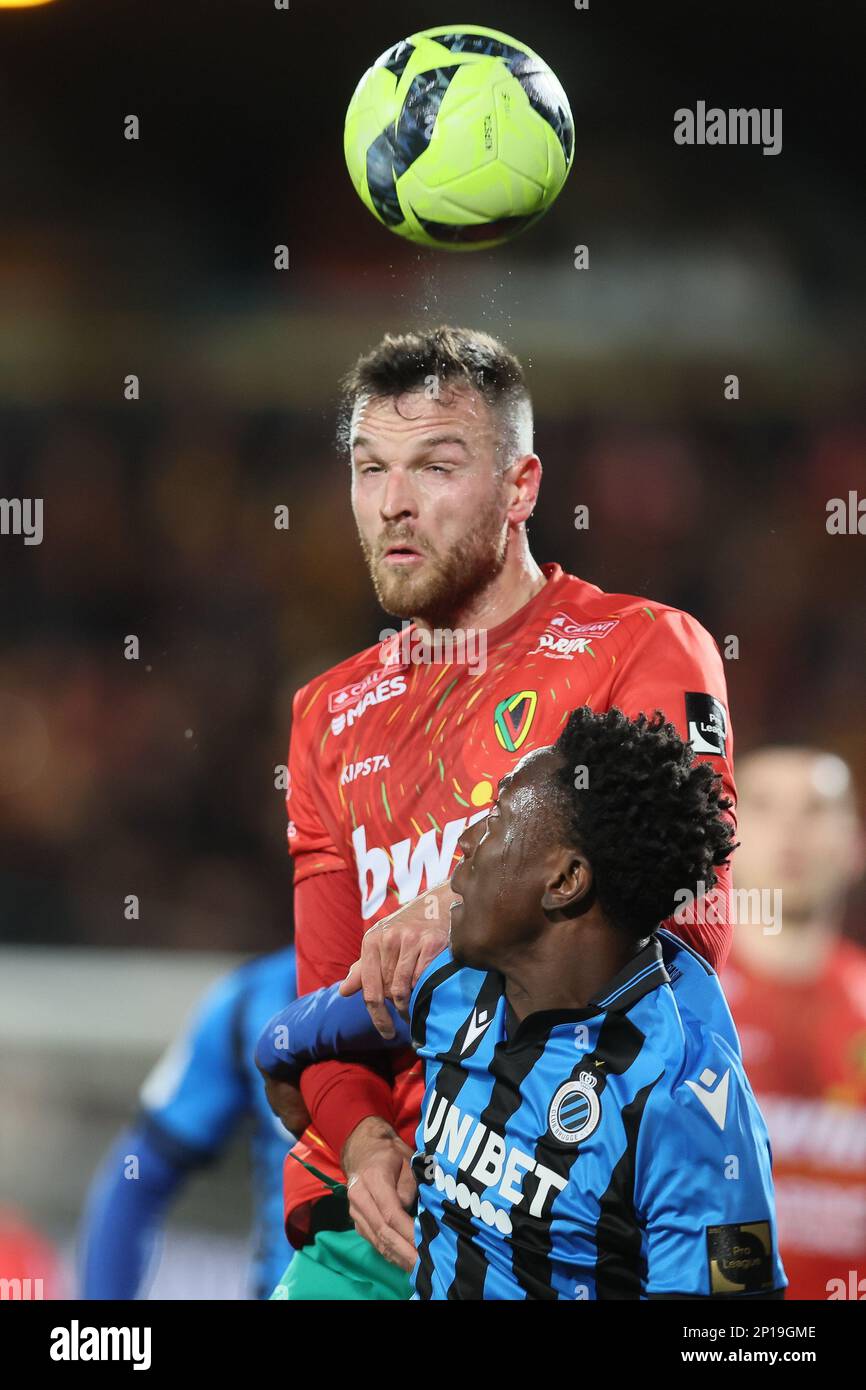 Oostende's Kyle Duncan and Club's Kamal Sowah fight for the ball during ...