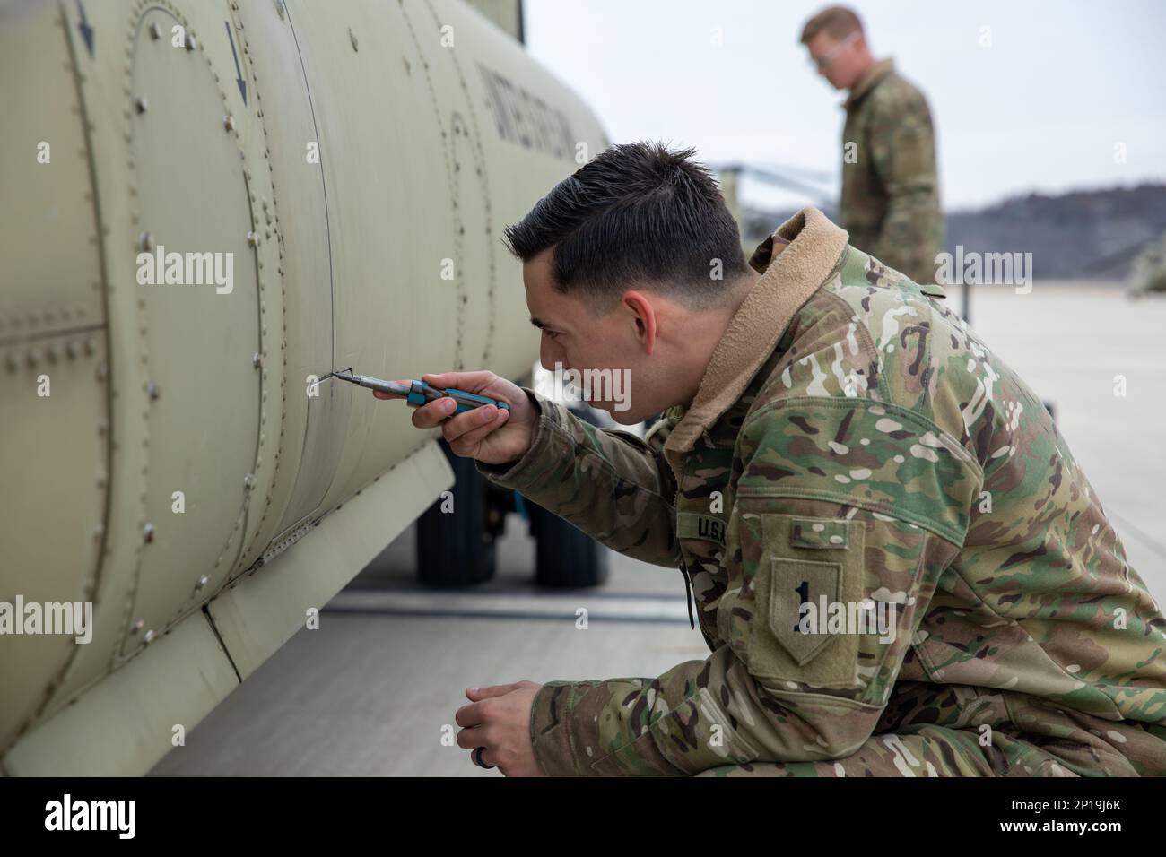 U.S. Army Sgt. Keith Candiano, a CH-47 helicopter mechanic assigned to ...