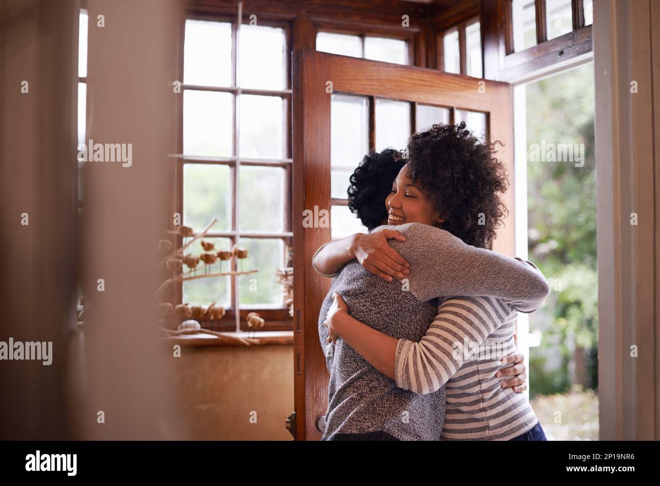 Youre back. Cropped shot of a young woman greeting her husband at the ...