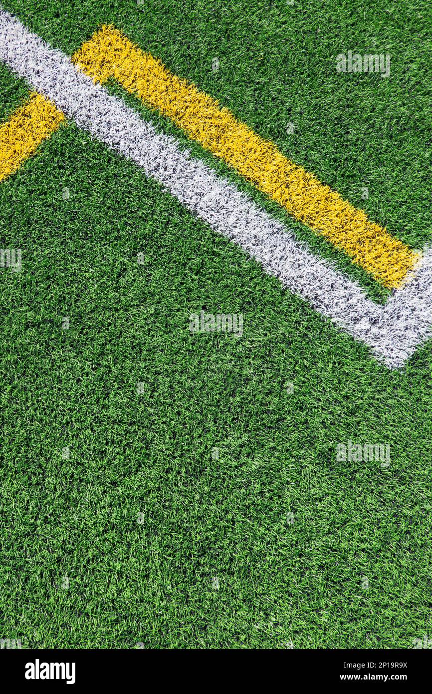 Green artificial grass turf soccer football field background with white ...