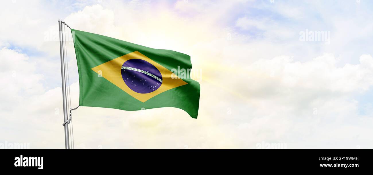 Brazil flag waving on sky background. 3D Rendering Stock Photo - Alamy