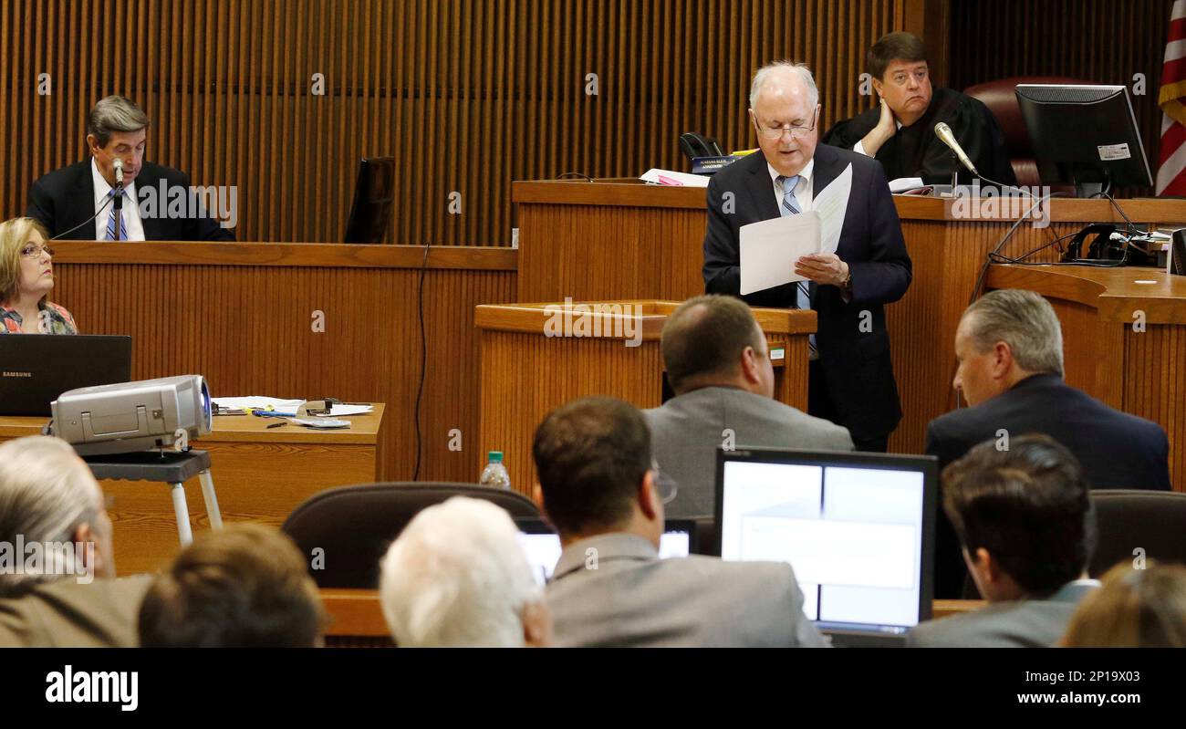 Defense attorney Bill Baxley, standing, reads an email with former ...