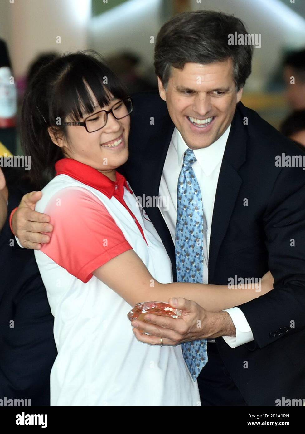 Timothy Shriver, right, Chairman and CEO of Special Olympics, hugs an ...