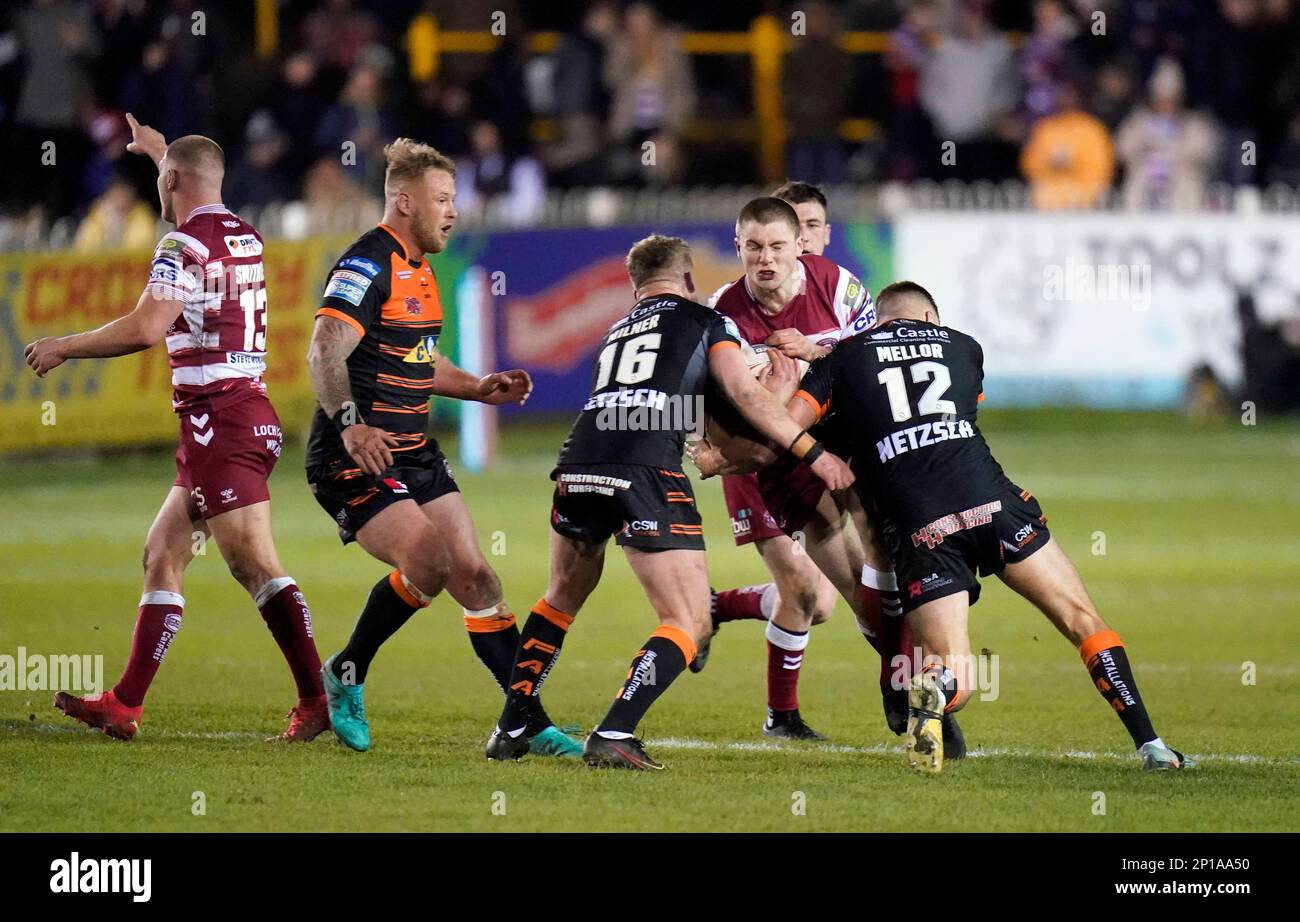 Wigan Warriors’s Ethan Harvard is tackled during the Betfred Super ...