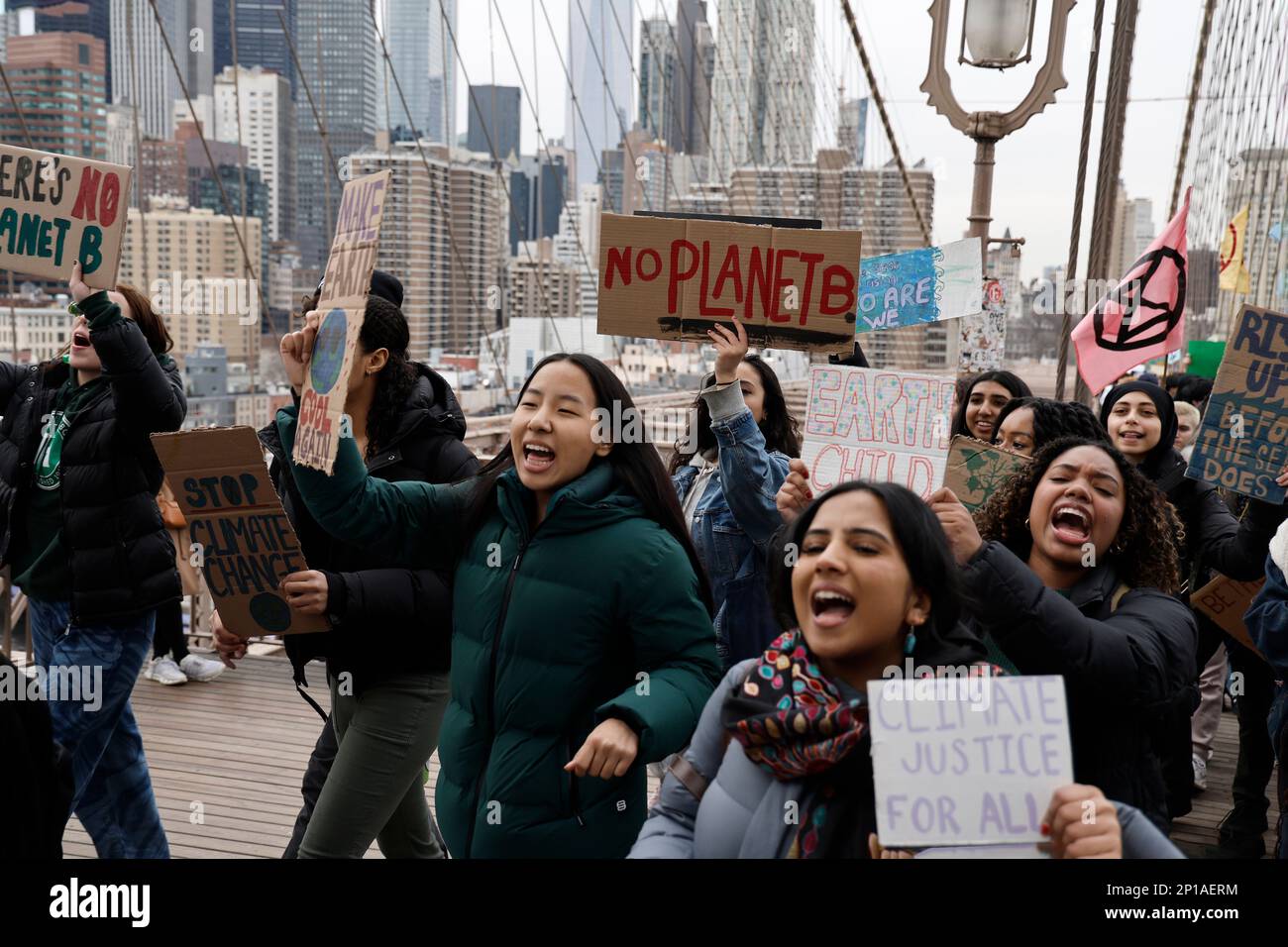New York City, USA. 03rd Mar, 2023. People march with signs chanting ...