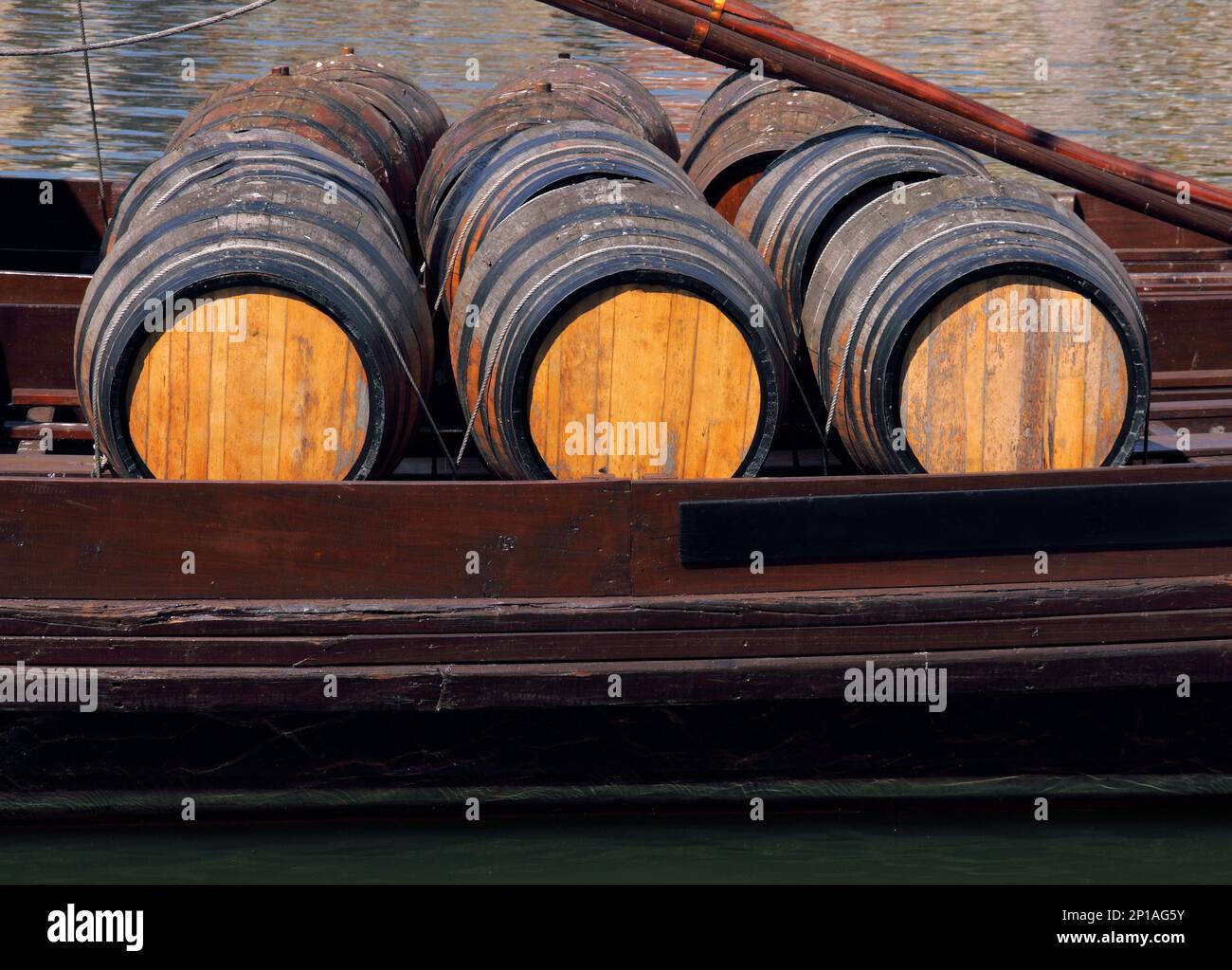Portugal, Porto. Wine barrels on a traditional rebelo boat which ...