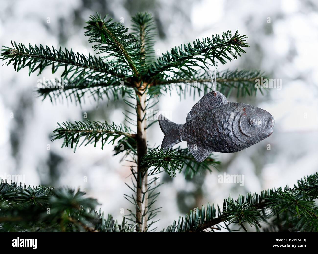carton christmas tree toy fish on a christmas tree branch Stock Photo ...