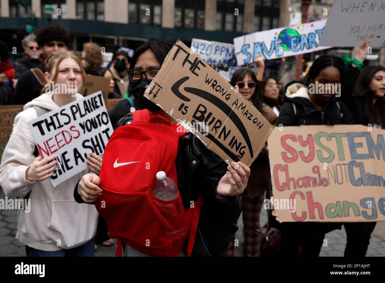 People march with signs chanting slogans from Manhattan to Brooklyn ...