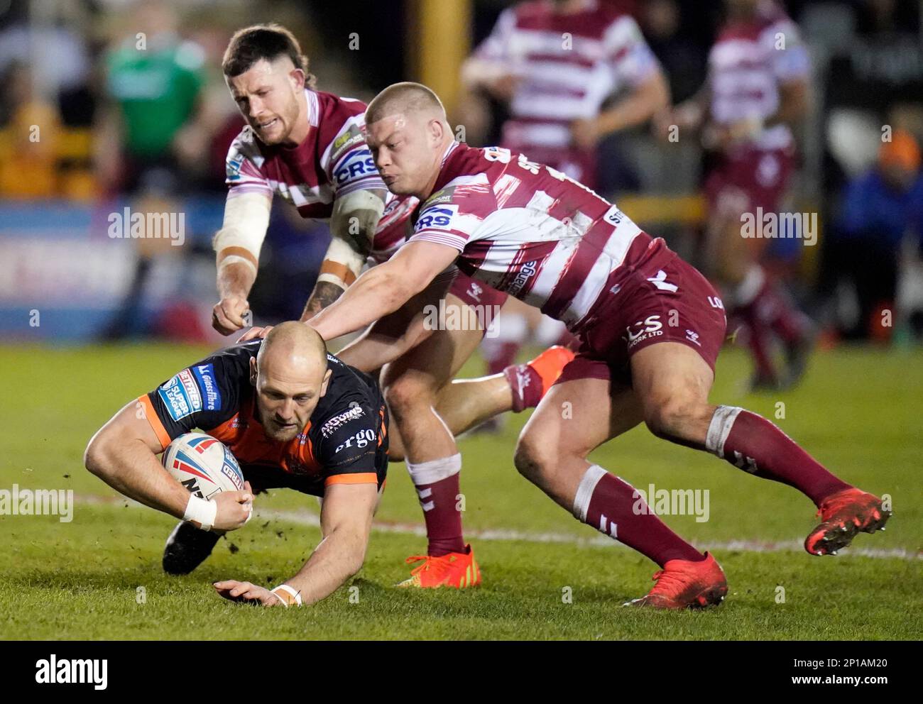 Castleford Tigers’ Liam Watts is tackled by Wigan Warriors’ Cade Cust ...