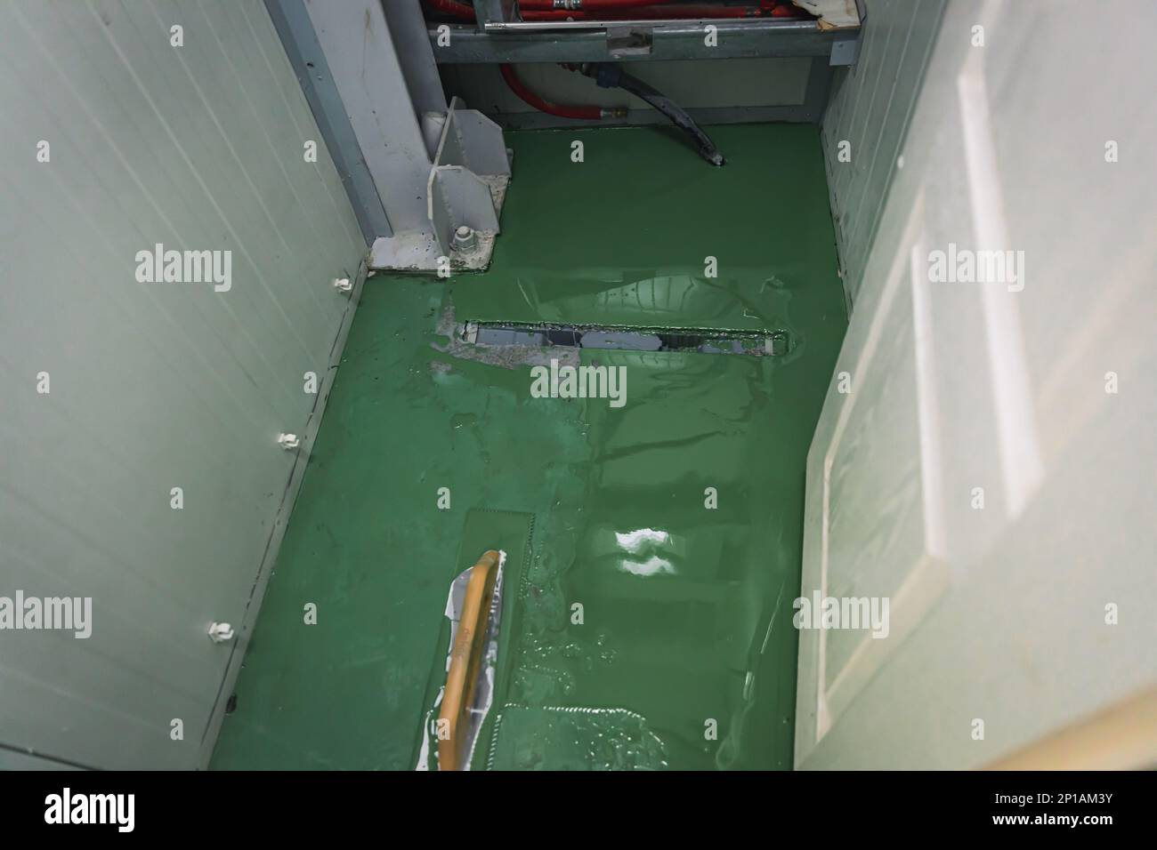 Floor under renovation with green epoxy resin.Applied over polished and ...