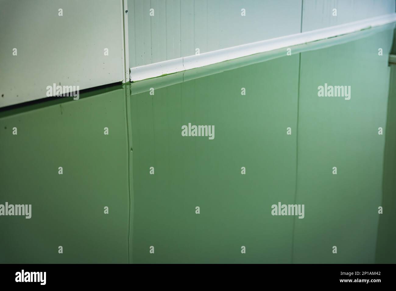 Epoxy and waxed green floor newly applied in the industrial hall Stock ...